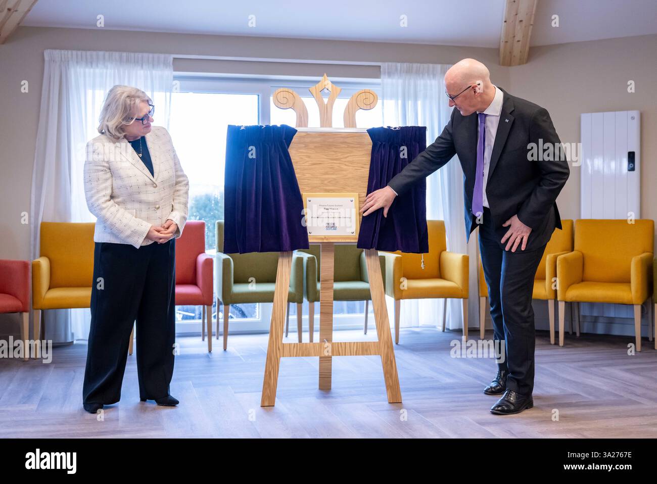 First Minister of Scotland John Swinney unveils a plaque to officially ...