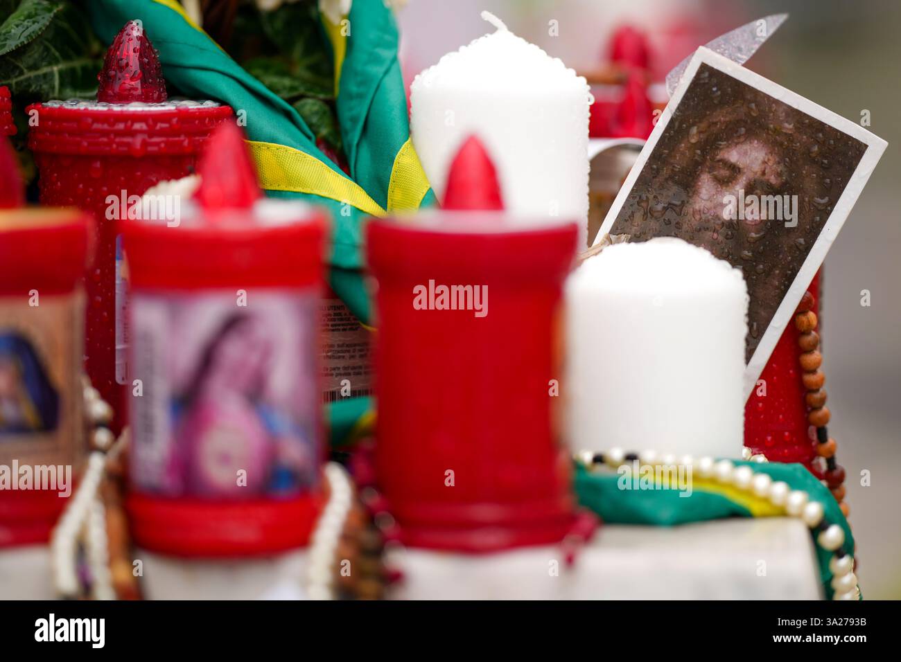 Candles for Pope Francis are seen in front of the Agostino Gemelli ...