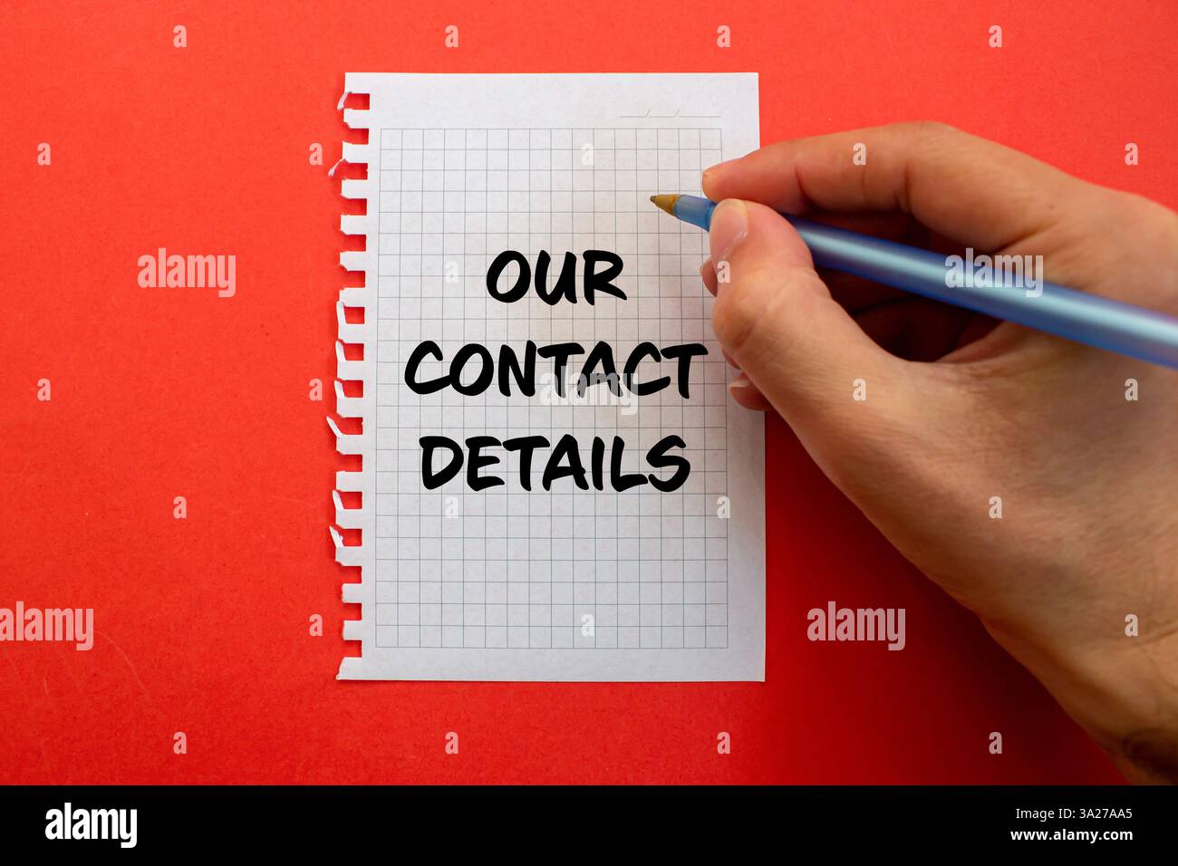 Our contact details message written on white paper on red background ...
