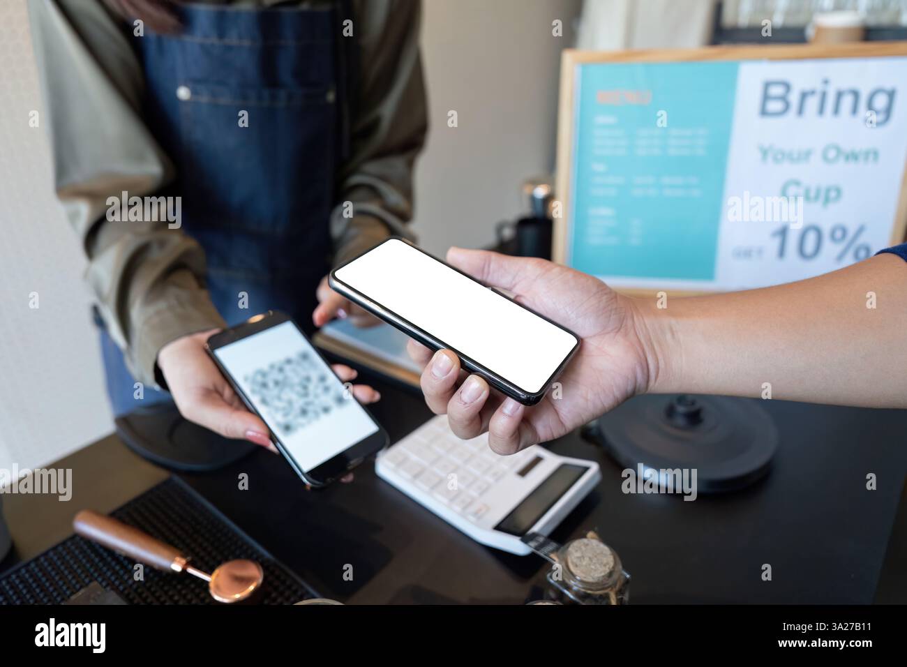 Digital Payments for Sustainability. A customer makes a mobile payment ...