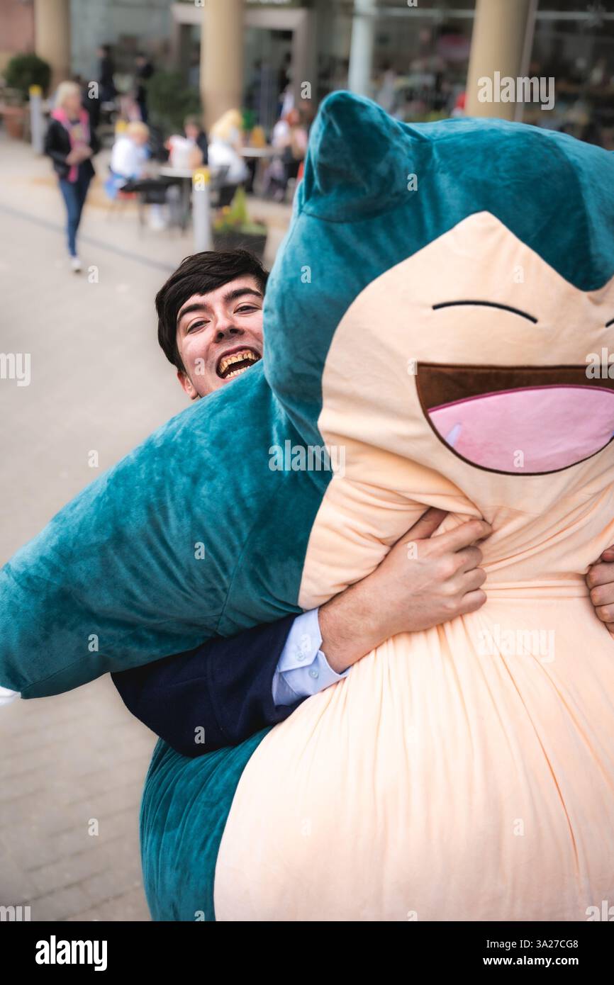 YORK, UK - MARCH 2, 2025. An excited and funny adult male hugging a ...