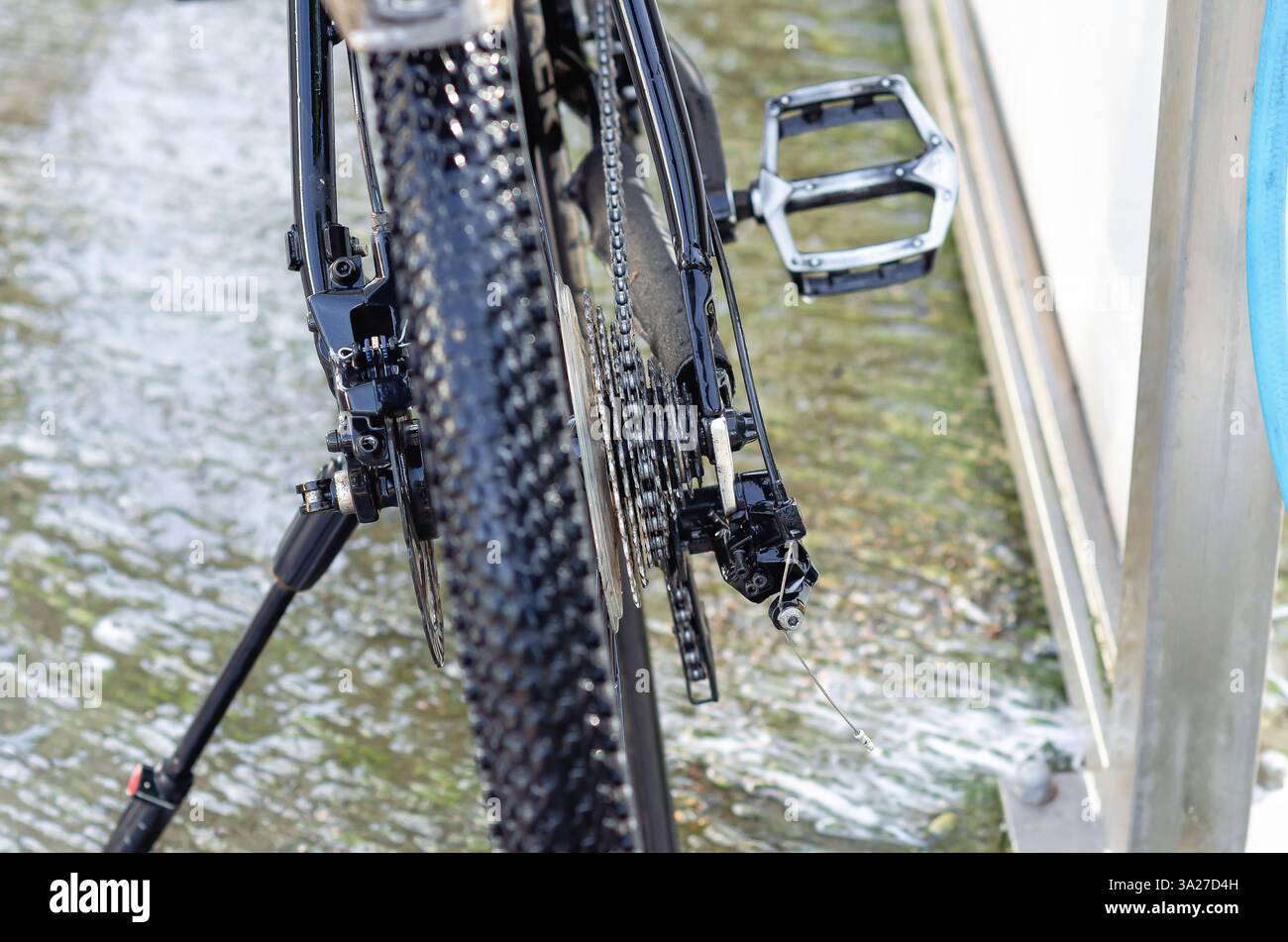 Washing a bicycle at a car wash with a stream of water Stock Photo - Alamy