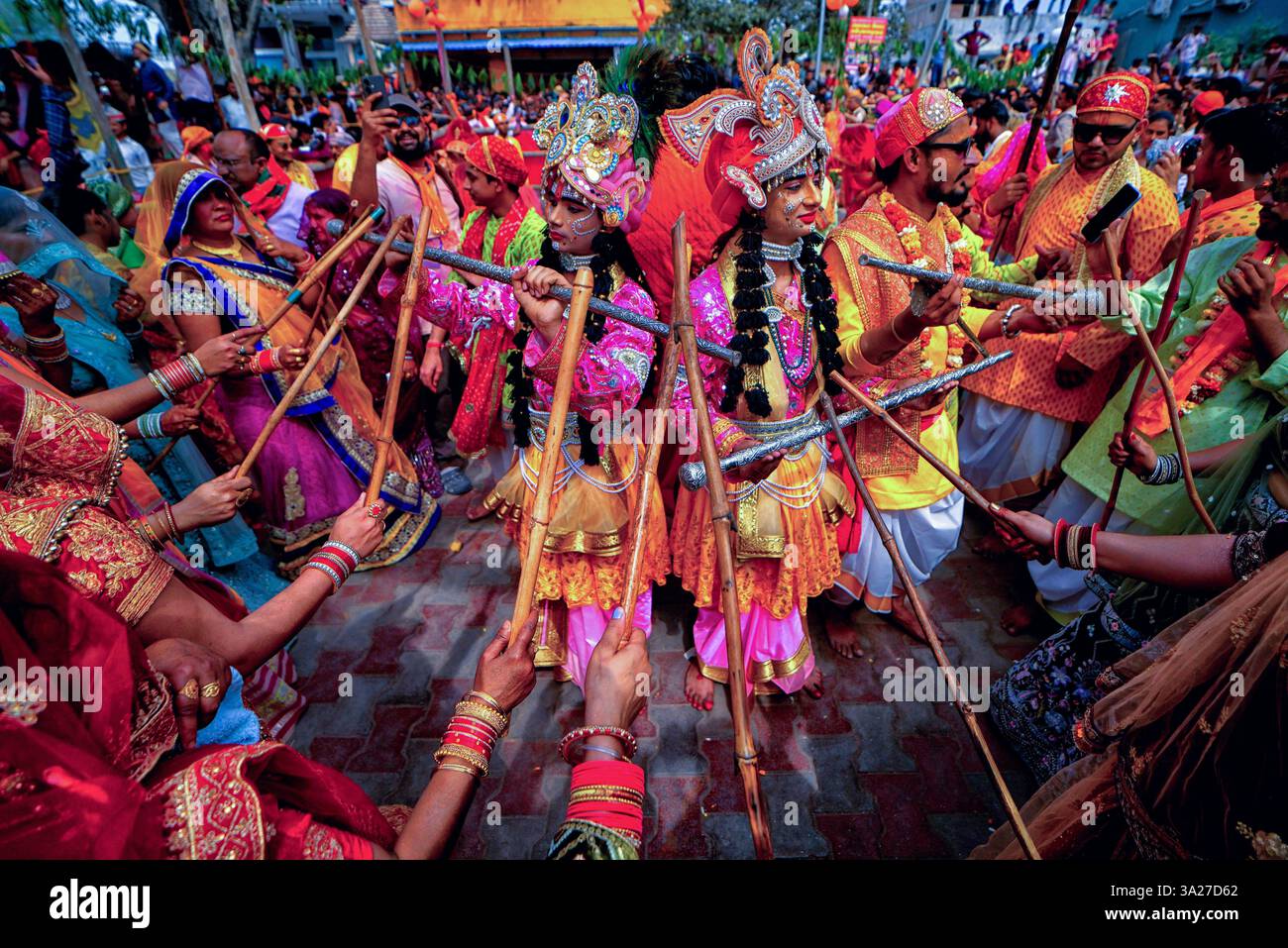 Mathura, India. 11th Mar, 2025. Hindu devotees are seen playing with ...