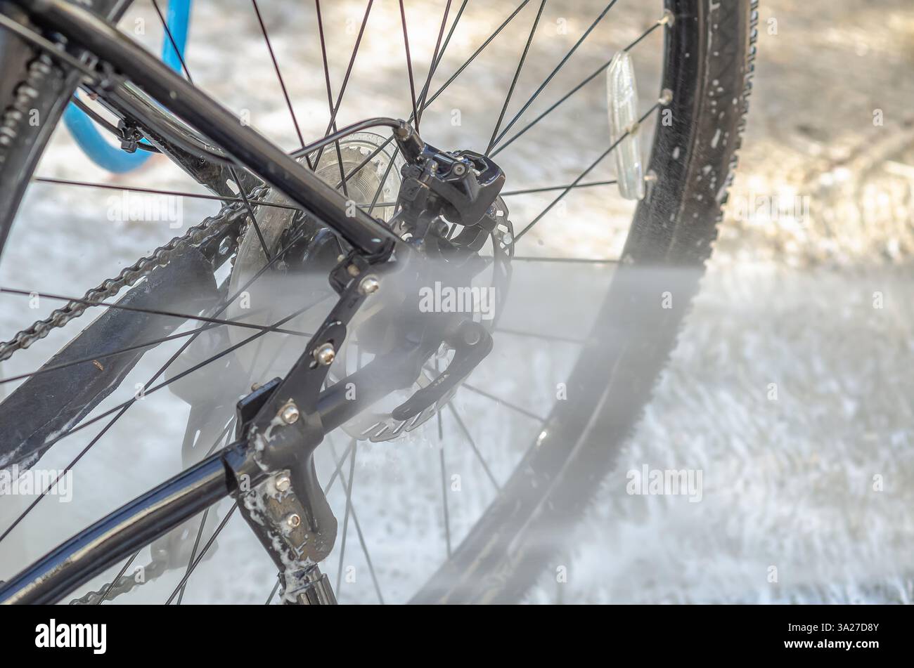 Washing a bicycle at a car wash with a stream of water Stock Photo - Alamy