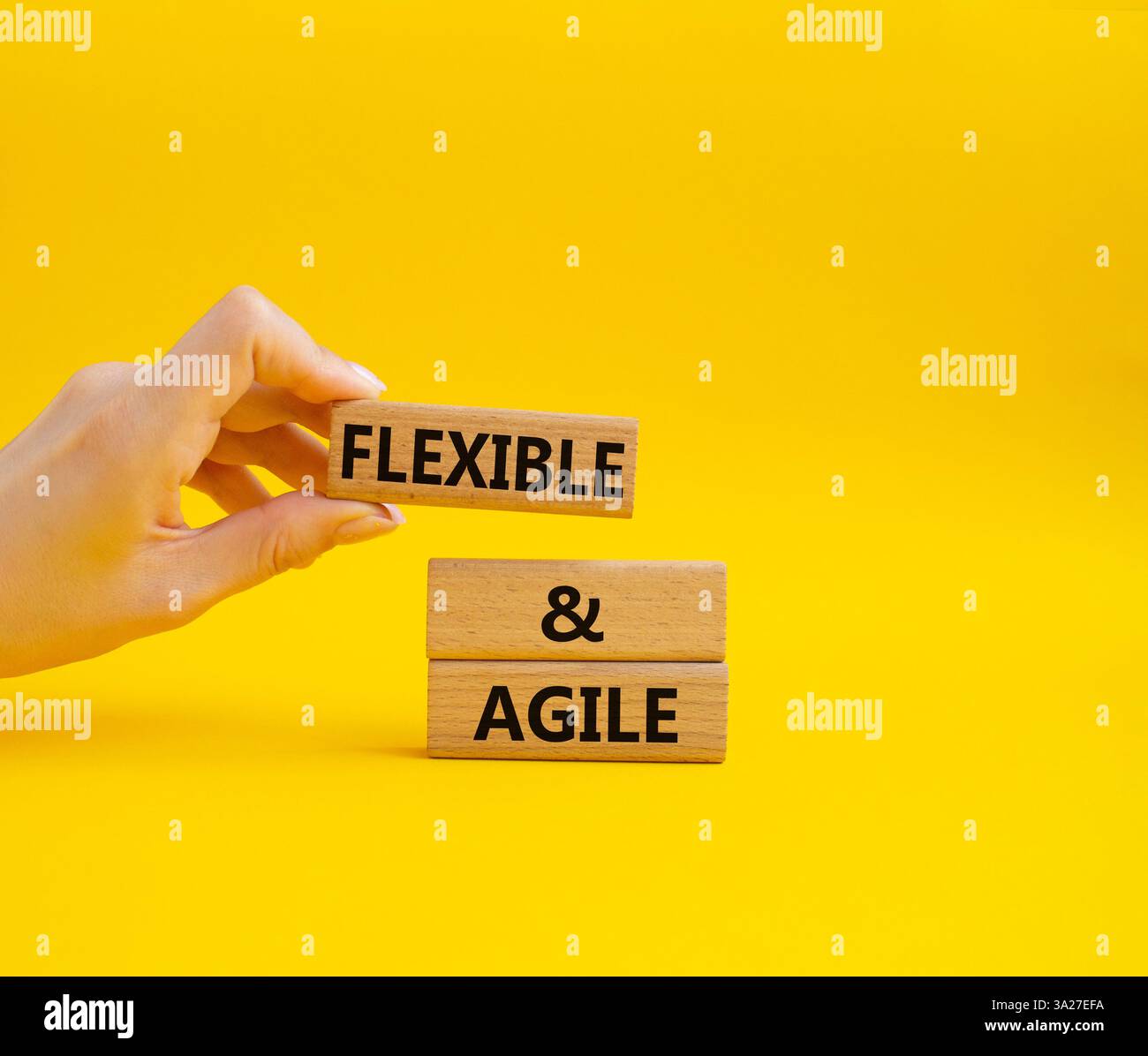 Flexible and agile symbol. Concept word Flexible and agile on wooden ...