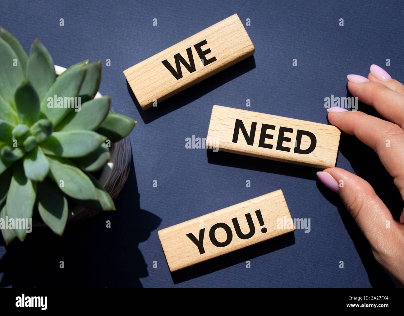 We need You symbol. Wooden blocks with words We need you. Beautiful ...
