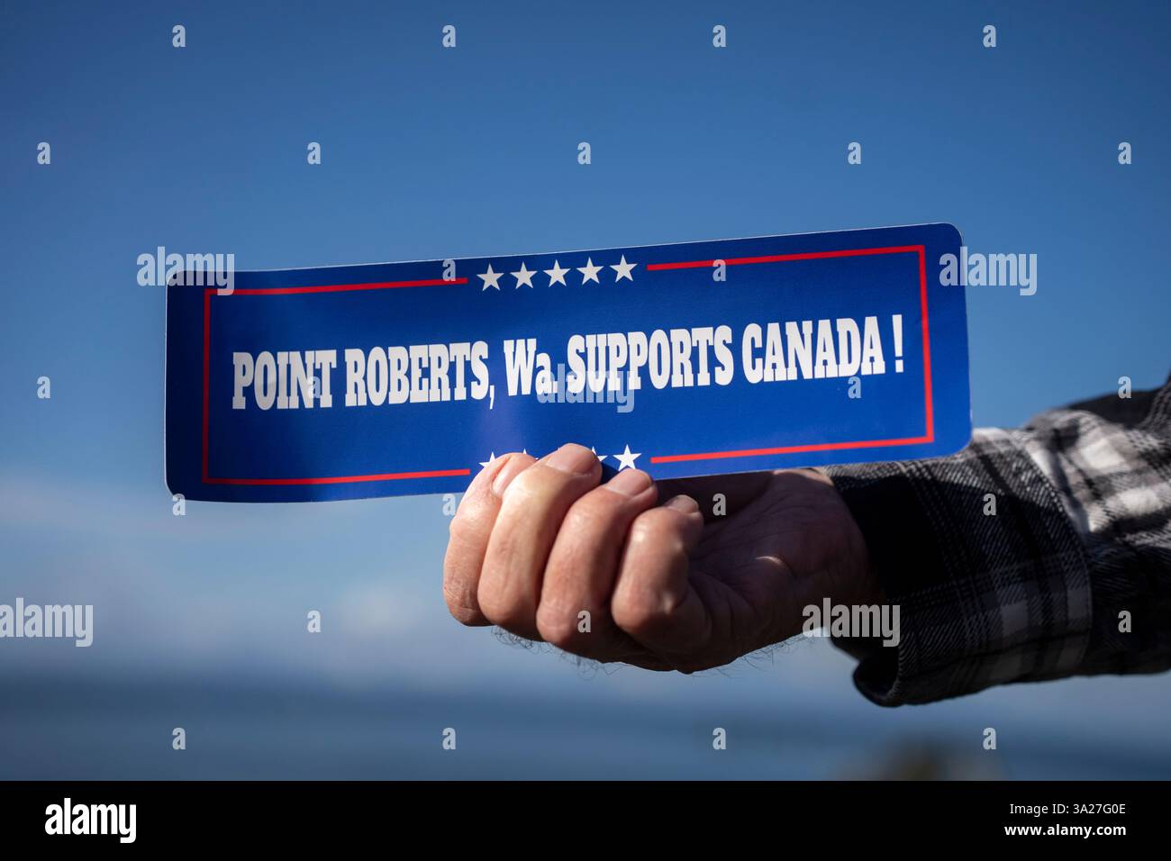 Point Roberts, United States. 05th Mar, 2025. Brian Calder holds a ...