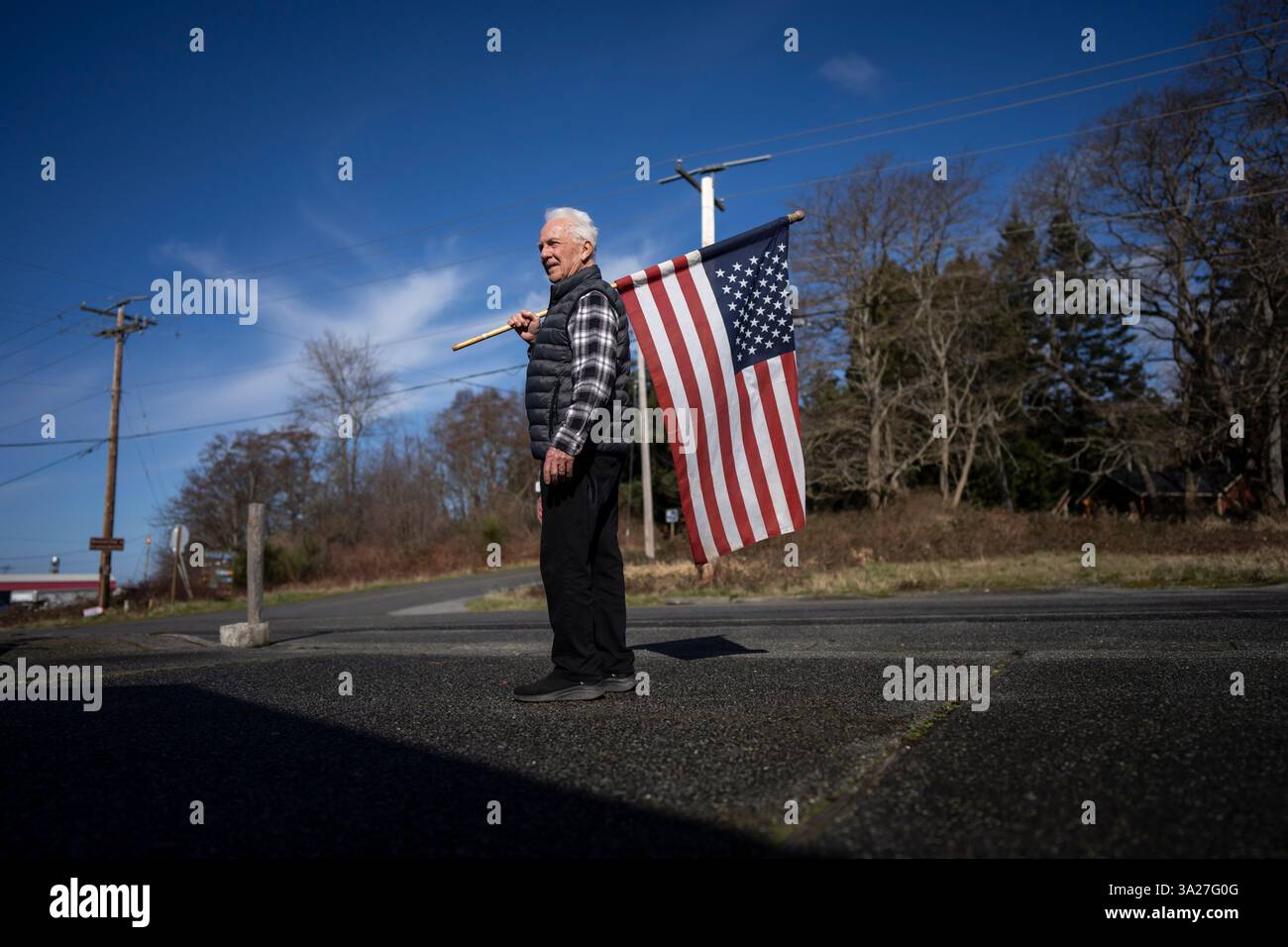 Point Roberts, United States. 05th Mar, 2025. Brian Calder holds a U.S ...