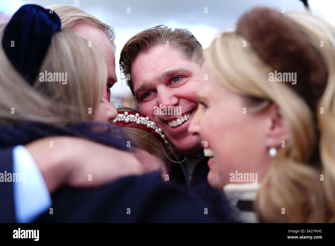 Trainer Dan Skelton (centre) celebrates in the winner's enclosure with ...