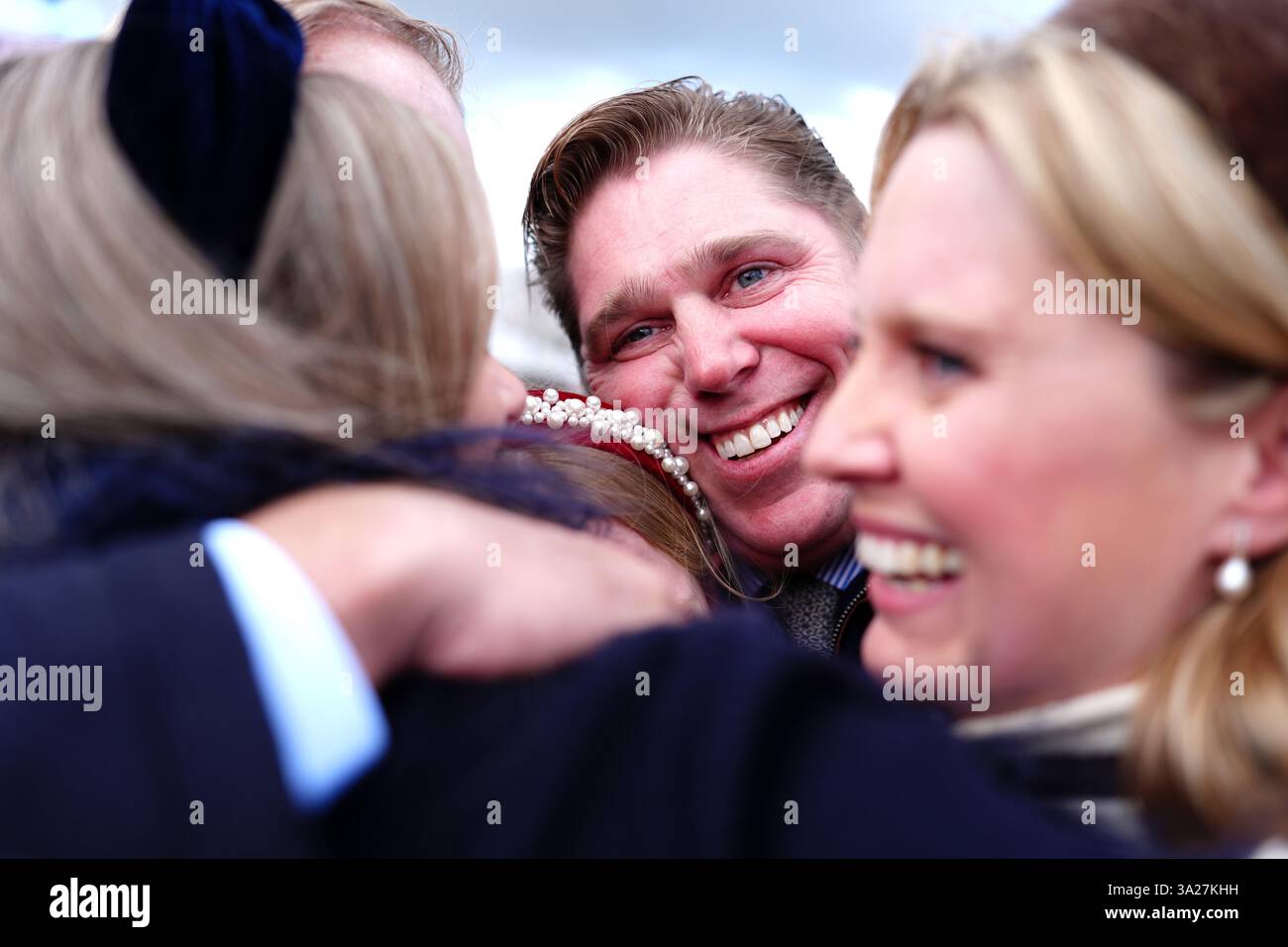Trainer Dan Skelton (centre) celebrates in the winner's enclosure with ...
