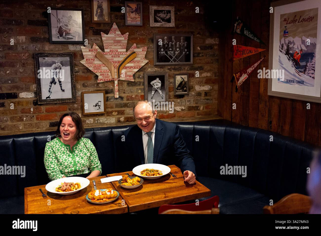 Liberal Democrats leader Sir Ed Davey, eats some food at the Canadian ...