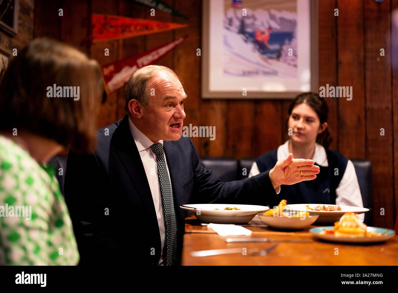 Liberal Democrats leader Sir Ed Davey, eats some food at the Canadian ...