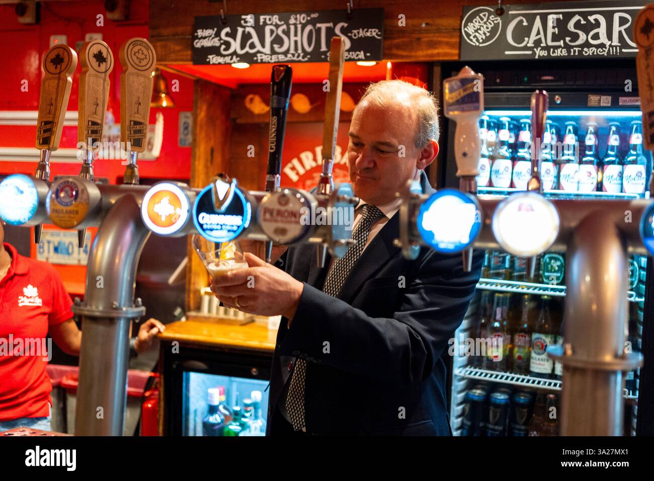 Liberal Democrats leader Sir Ed Davey, pulls a pint at the Canadian ...