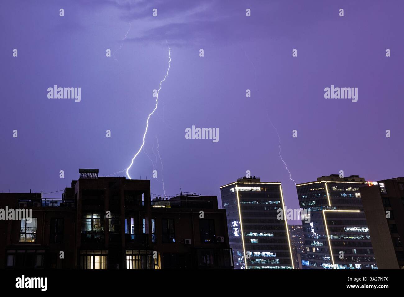 Lightning is seen over the city of Hangzhou, Zhejiang province, China ...