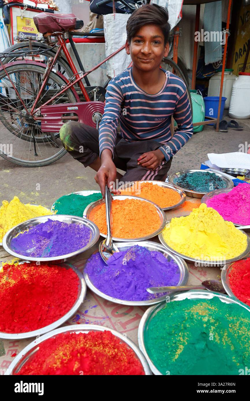 A child vendor selling Gulal (coloured powder) for the Holi Festival in ...