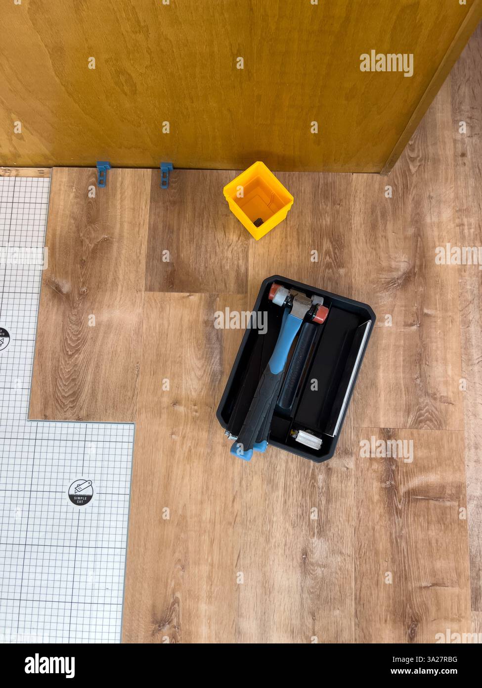 Flooring Installation Tools on New Wood Floor Stock Photo - Alamy