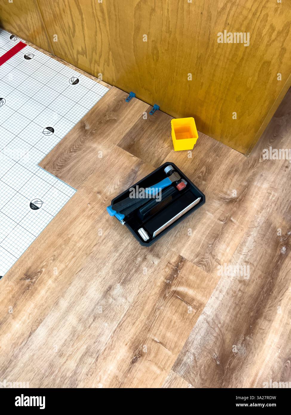 Flooring Installation Tools on New Wood Floor Stock Photo - Alamy
