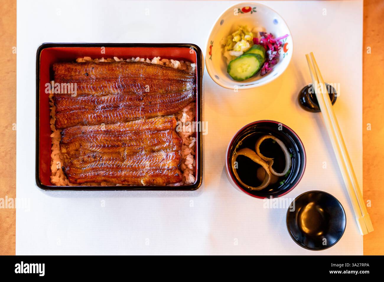 Japanese unagi donburi set presented from above, including glazed hot ...