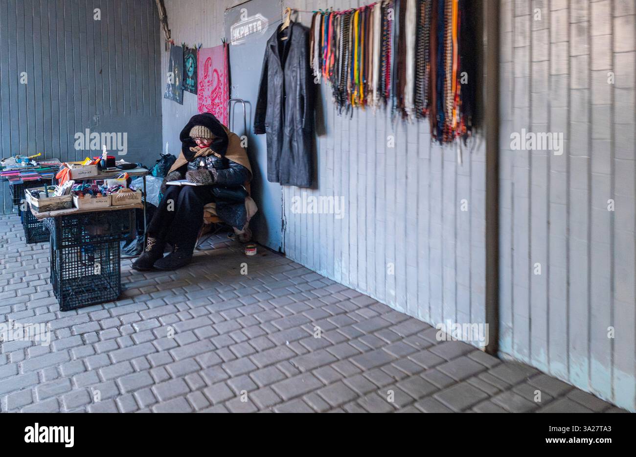 Kyiv, Ukraine - March 2025: On a brisk day, a local artisan crafts ...