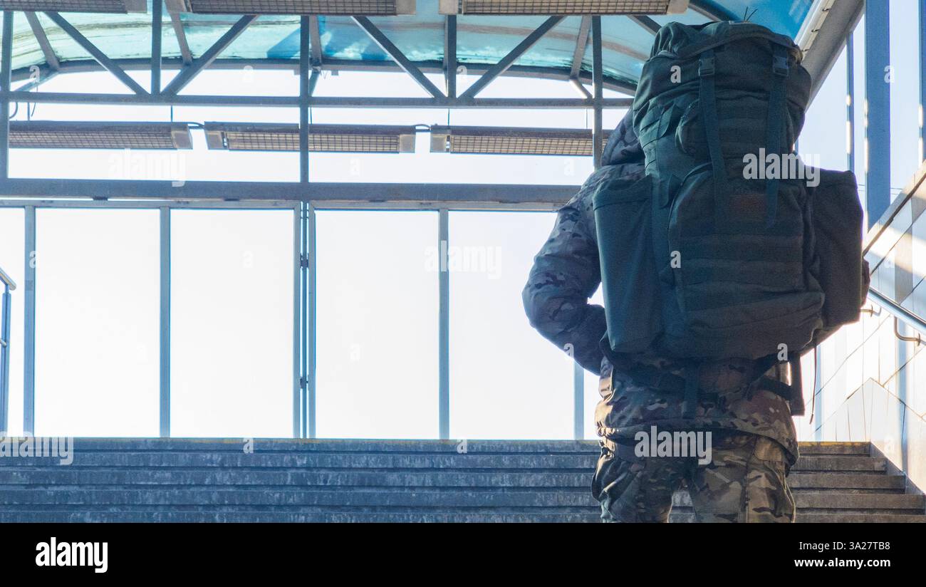 Kyiv, Ukraine - 2d March, 2025: A soldier ascends the steps of a ...