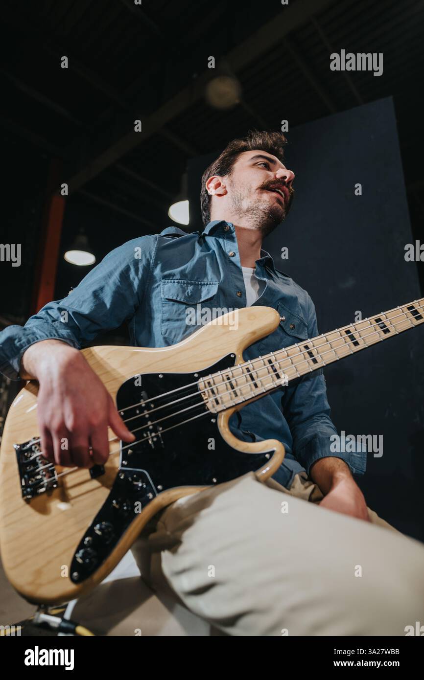 Musician Playing Bass Guitar in a Studio During Rehearsal Stock Photo ...