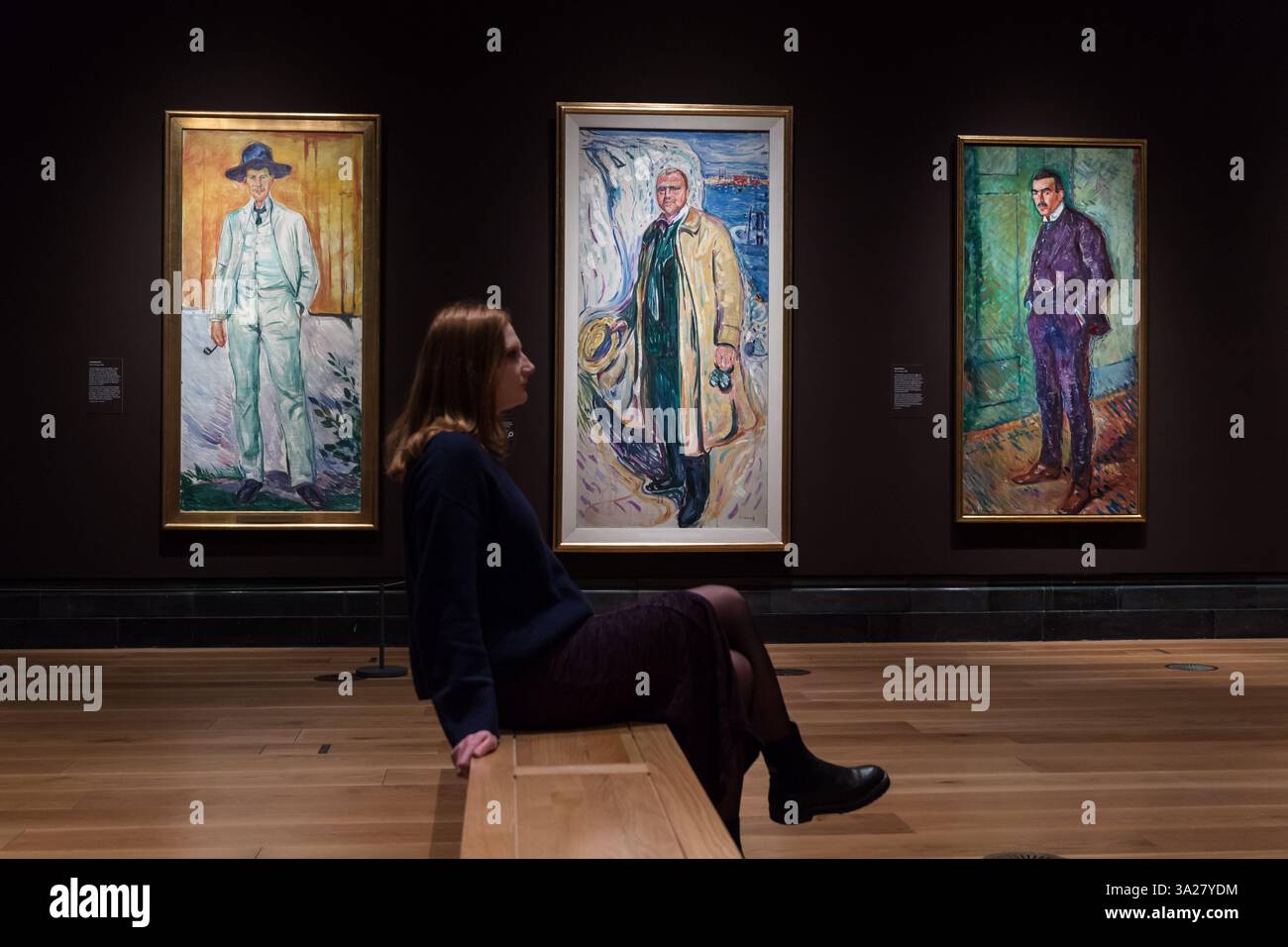 LONDON, UNITED KINGDOM - MARCH 12, 2025: A gallery staff member with ...
