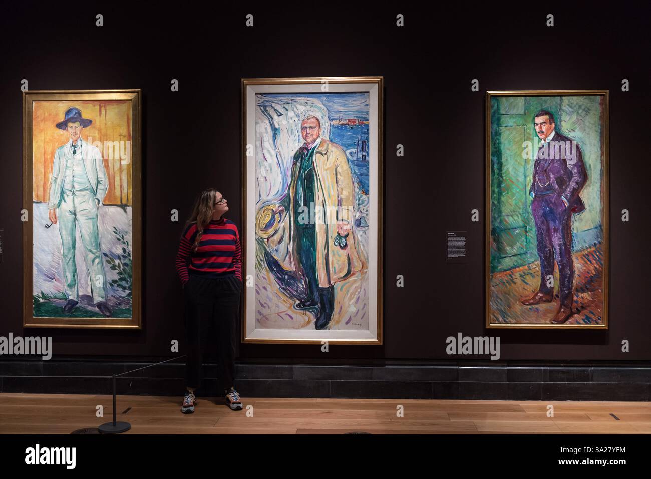 LONDON, UNITED KINGDOM - MARCH 12, 2025: A gallery staff member with ...