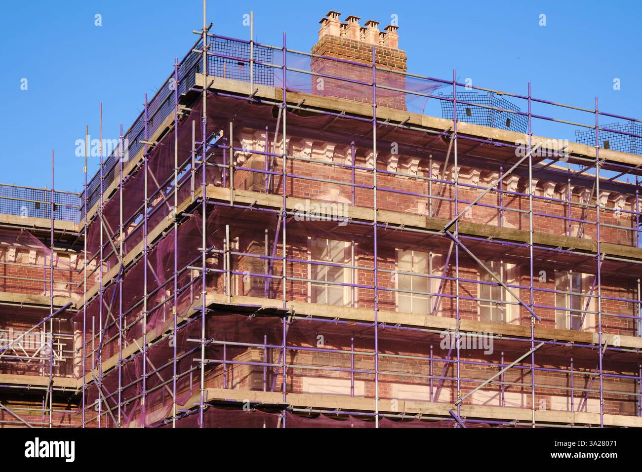scaffolding erected against an old building Stock Photo - Alamy