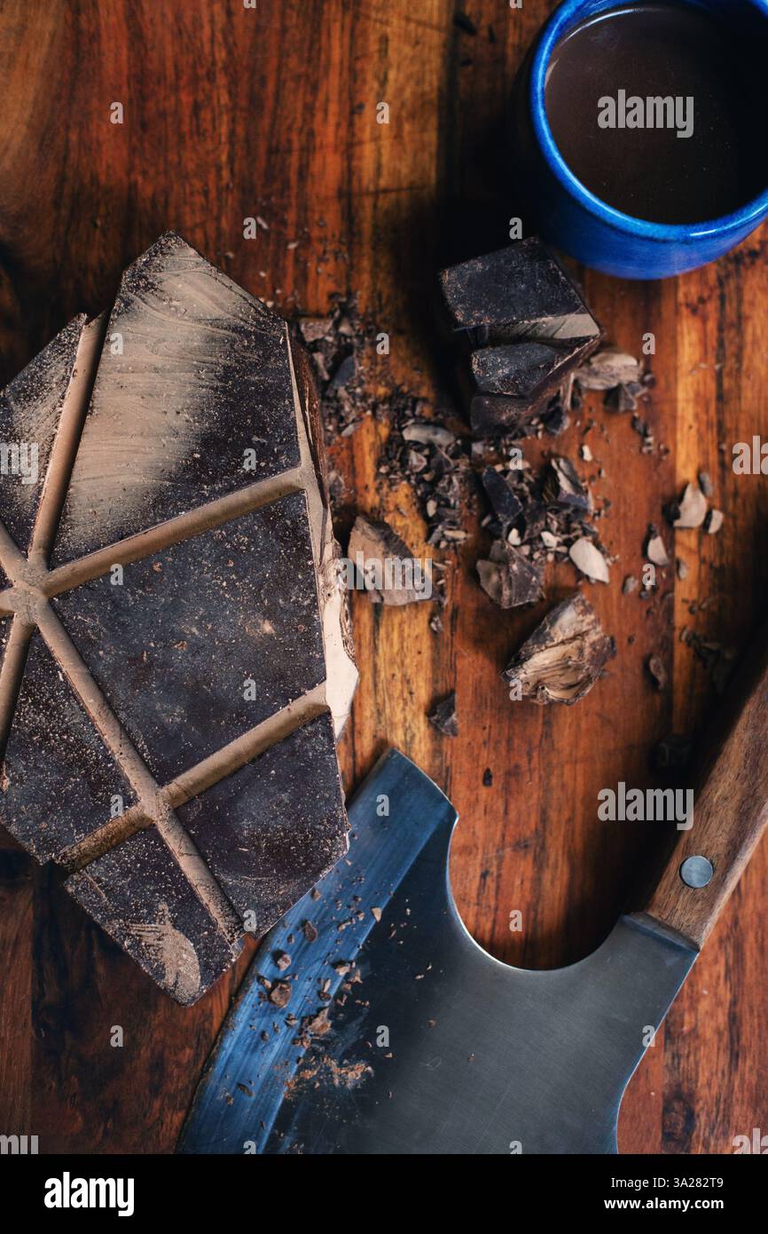 Ceremonial cacao preparation with raw cacao block and hot cacao in ...