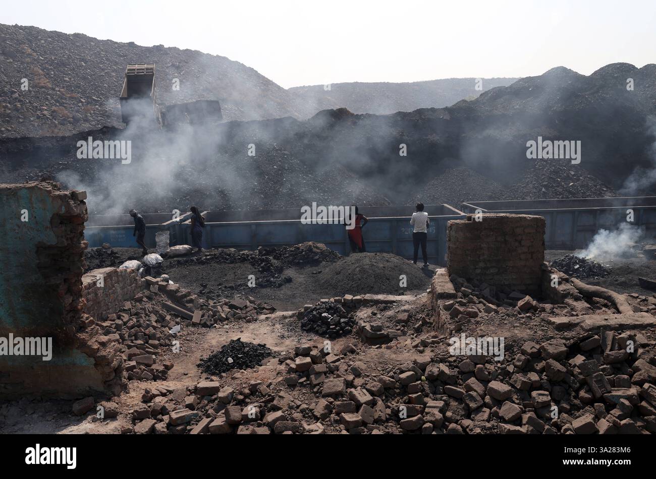 Coal mines of Jharkhand, India Coal scavengers burn coal piles in an ...