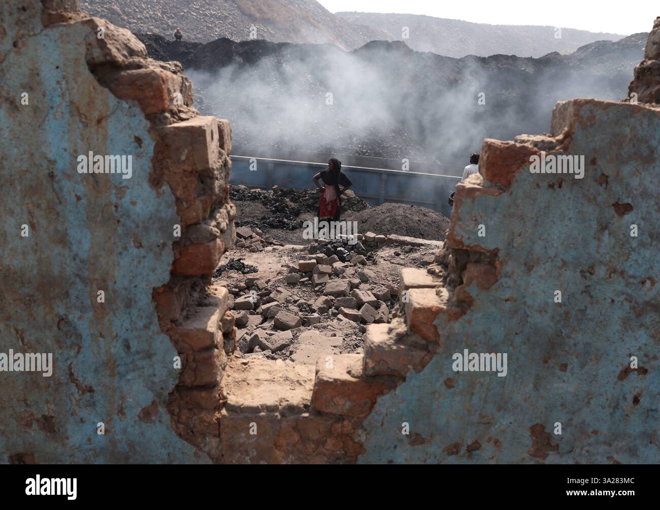 Coal mines of Jharkhand, India Coal scavengers burn coal piles in an ...