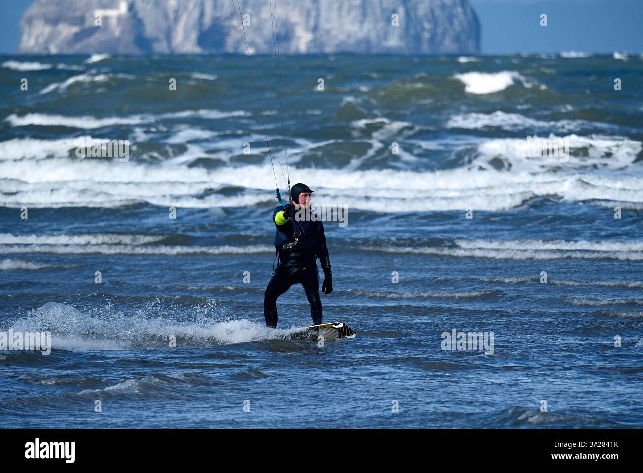 Dunbar, UK. 12th Mar, 2025. A Kite Surfer out in Belhaven Bay near to ...