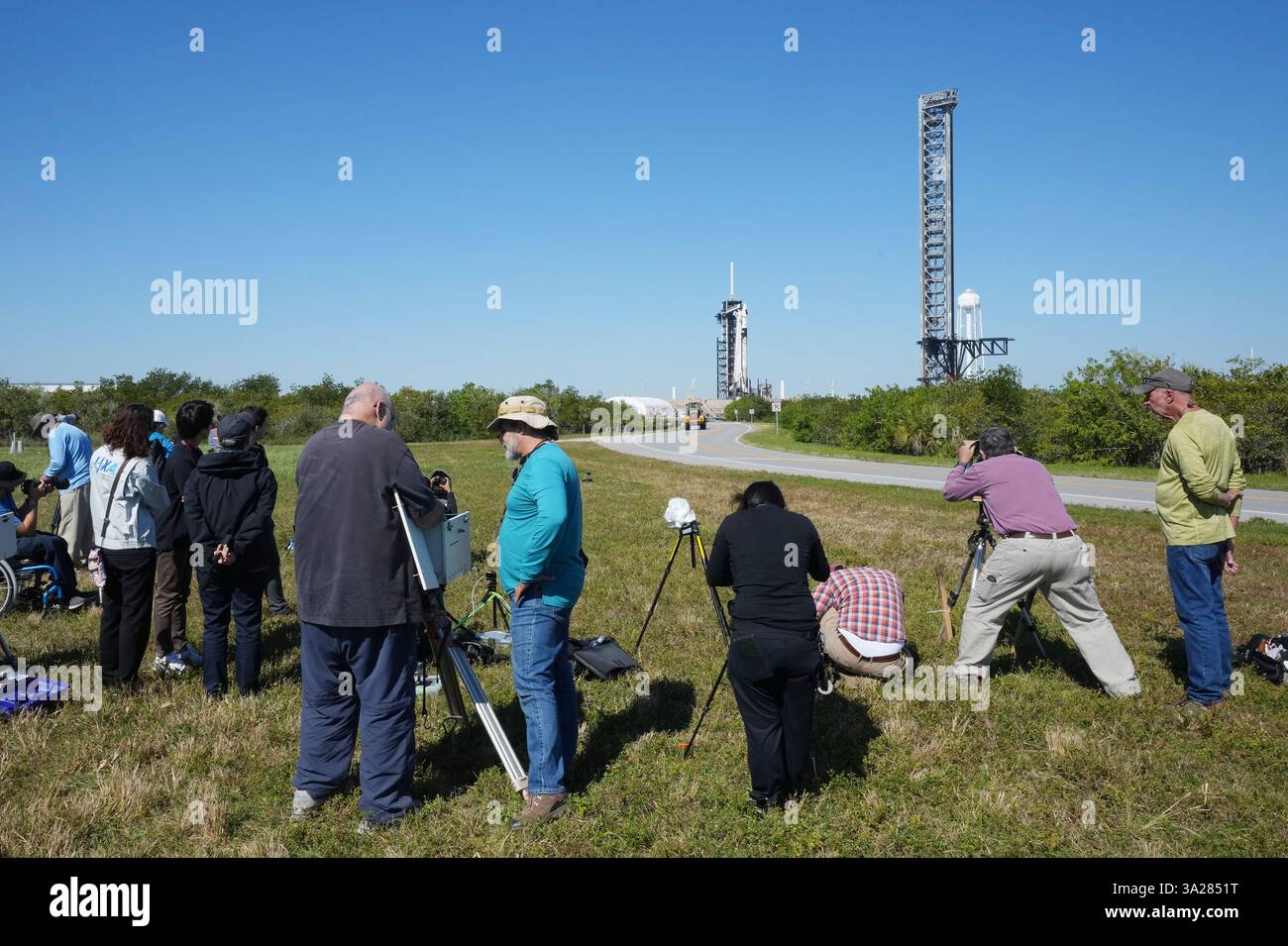 News photographers set up remote cameras before a SpaceX Falcon 9 ...