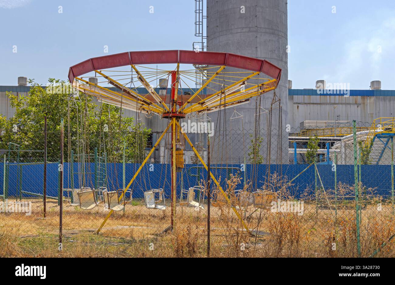 Abandoned Carousel Ride for Children at Park Behind Factory Building ...