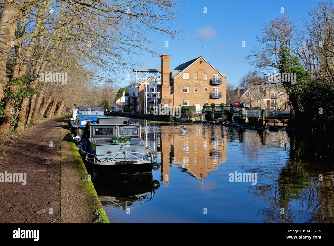 The River Wey navigation canal at Thames lock with waterside modern ...