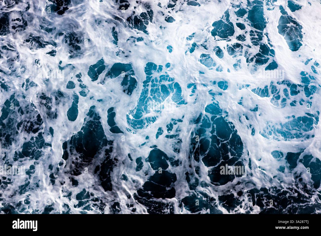 Ocean water surface texture. Aerial view of awesome water with foam ...