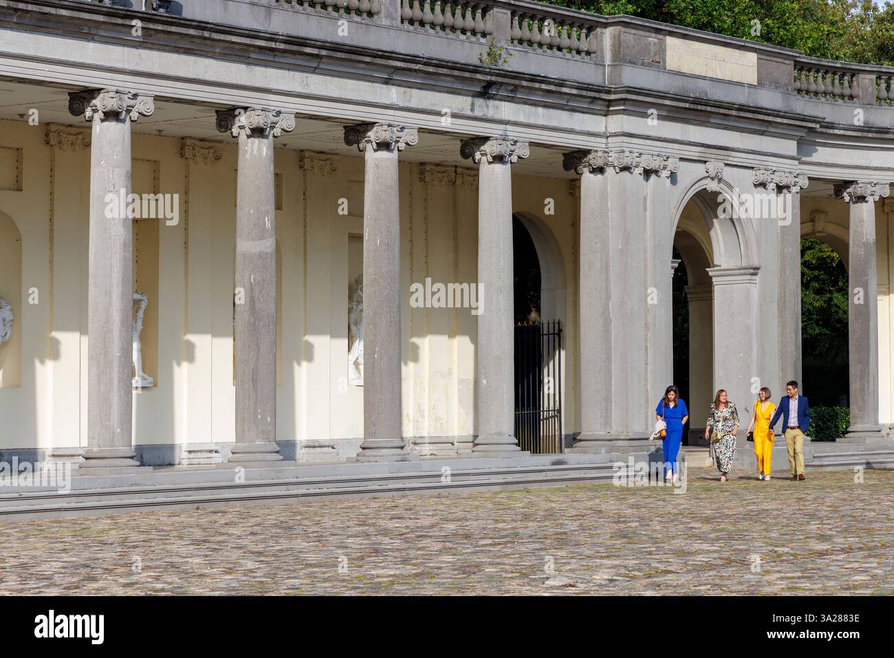 People walking in front of the Chateau de Seneffe, Seneffe, Wallonia ...