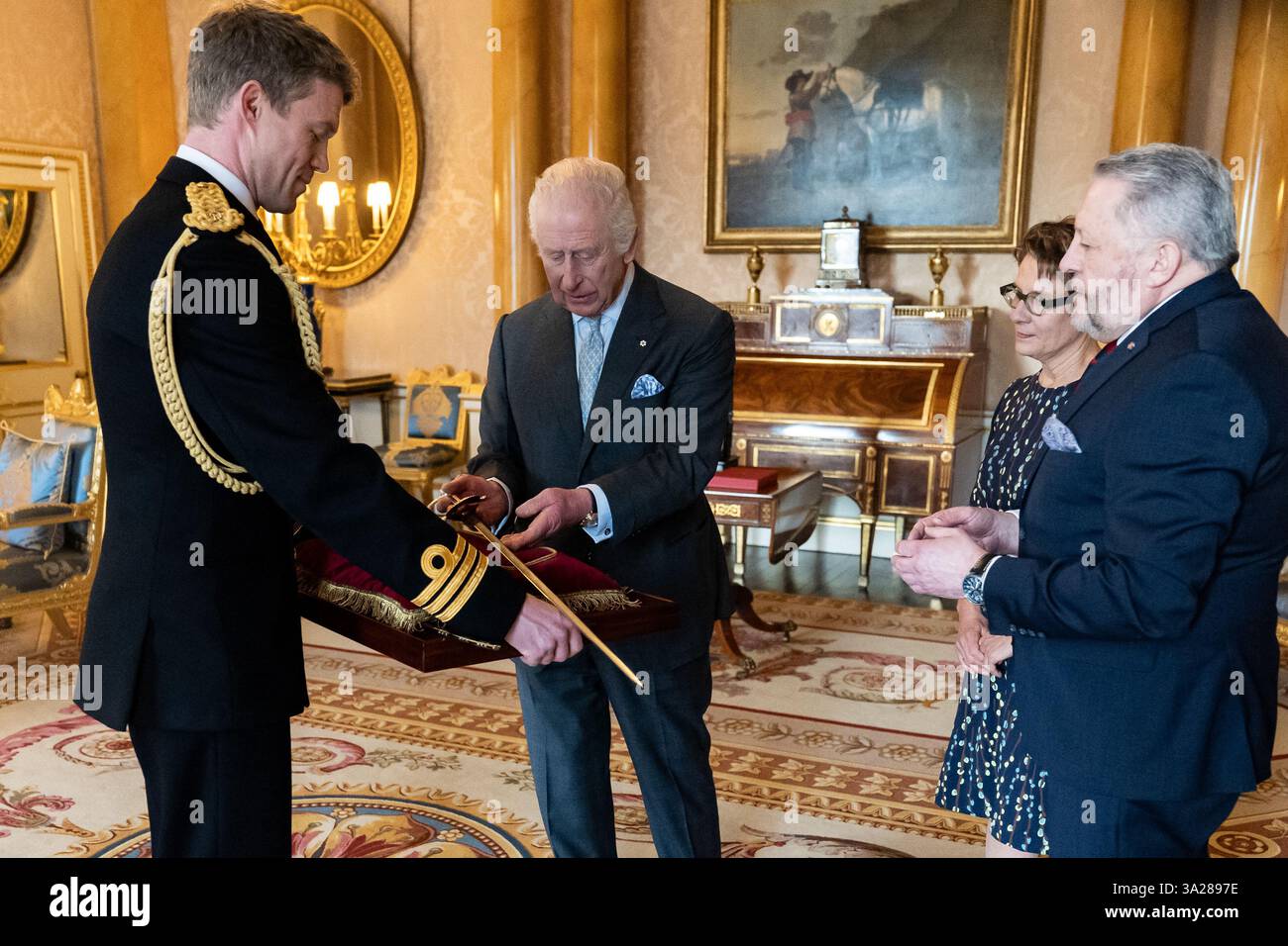 King Charles III bestows a new ceremonial sword to the Usher of the ...
