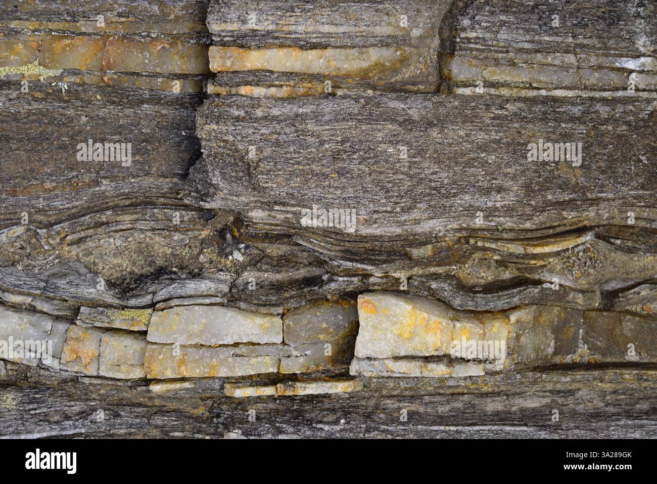 Layering of different rock types with fractures Stock Photo - Alamy