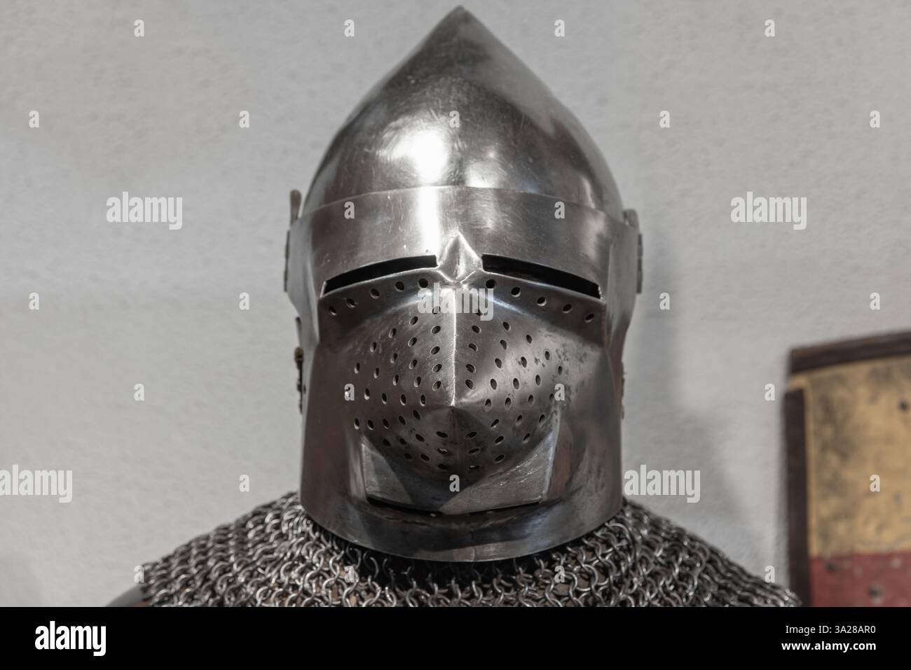 Detailed close-up frontal photo of a medieval knights metal helmet and ...