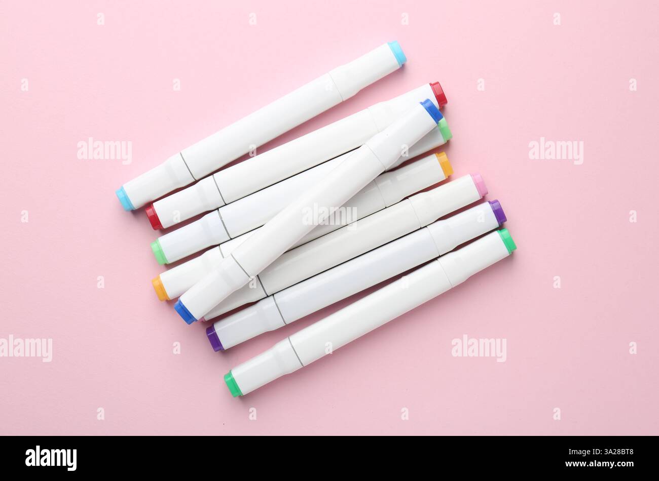 Colorful double sided markers on pink background, flat lay Stock Photo ...
