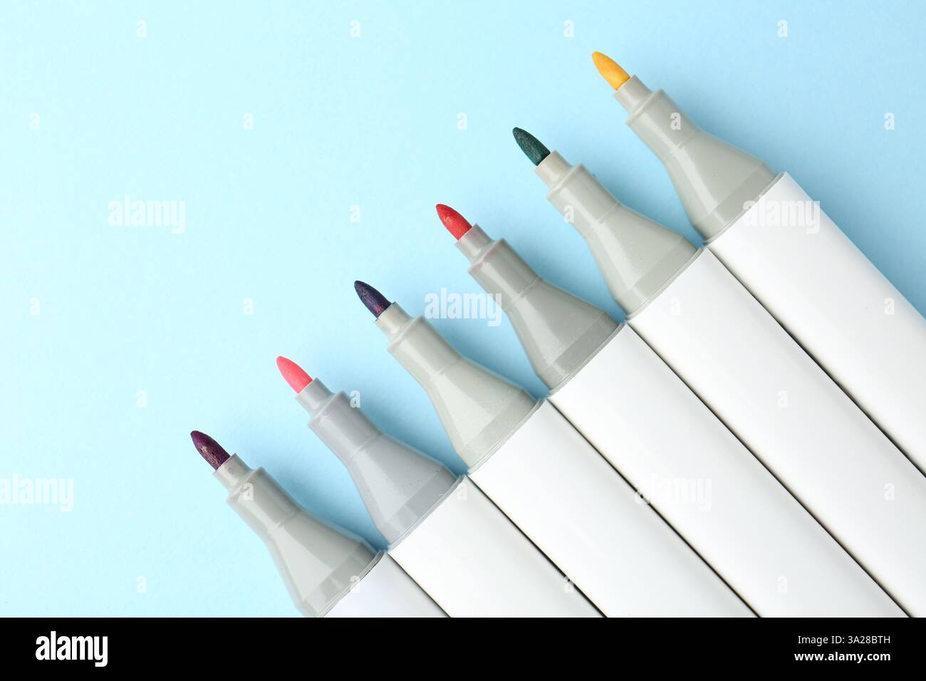 Colorful markers on light blue background, flat lay Stock Photo - Alamy