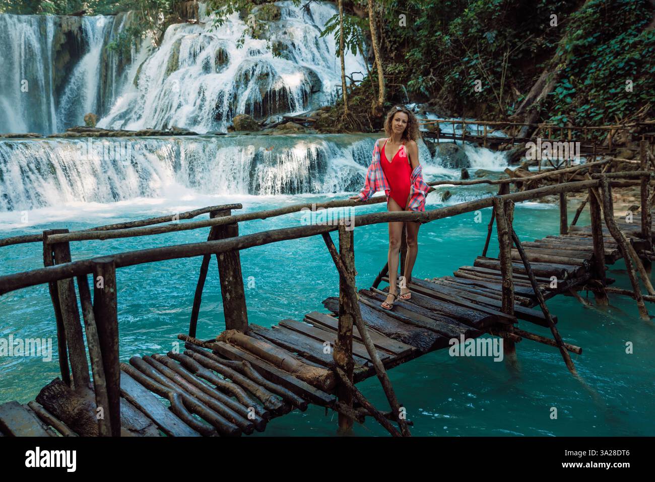 Beautiful traveller woman on bridge at cascade waterfalls with ...