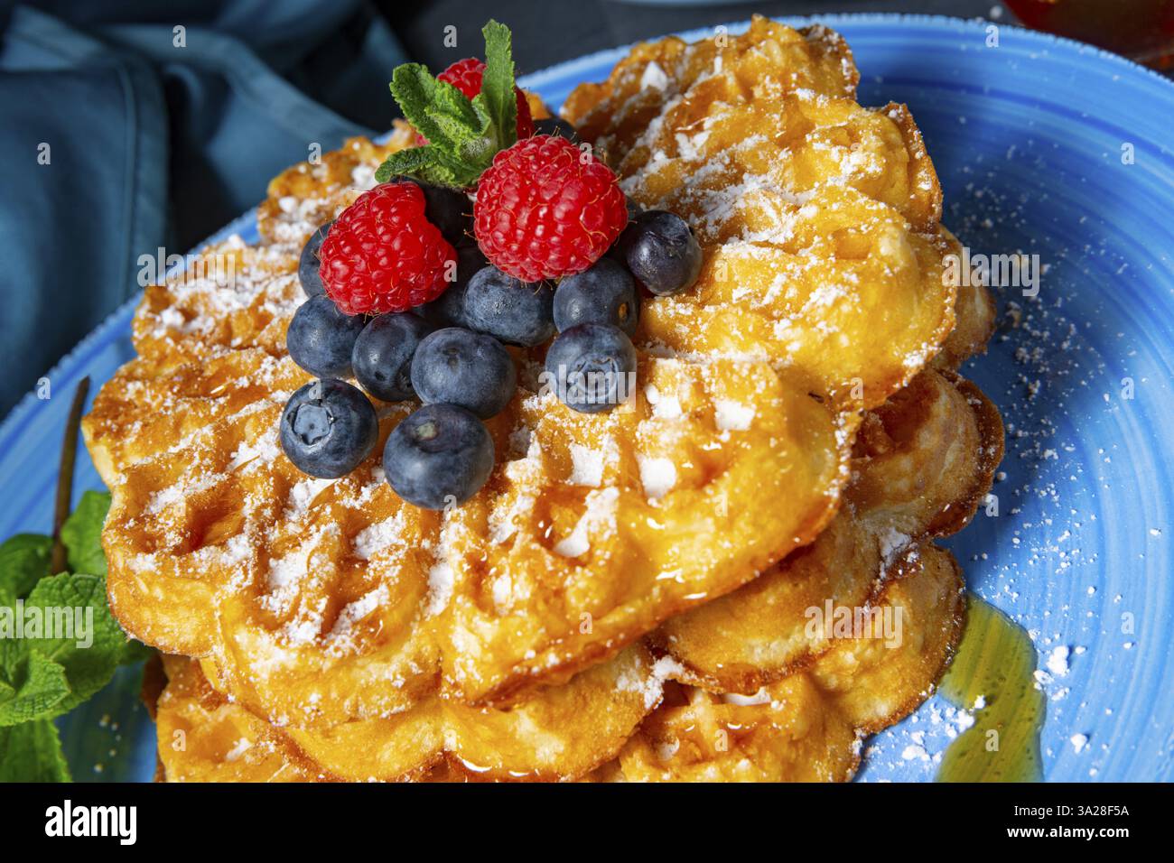 Simple sweet waffles with raspberries and blueberries Stock Photo - Alamy