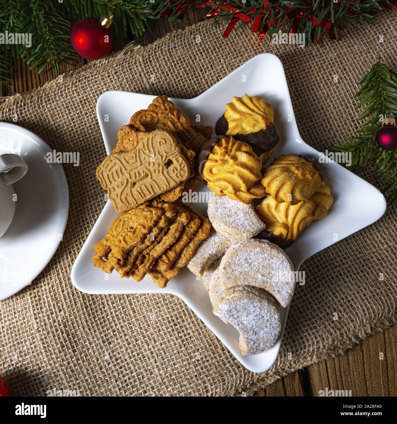 Different types of biscuits with rustic Christmas decorations Stock ...