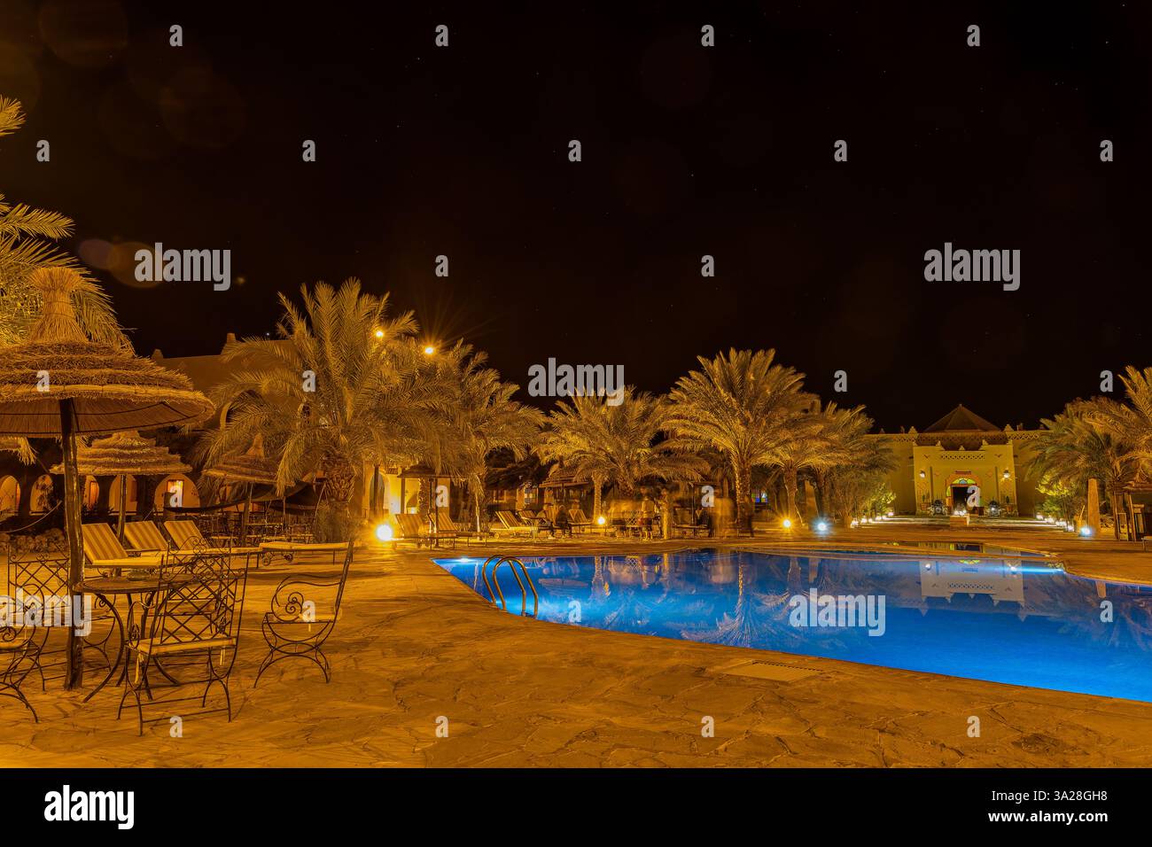 Kasbah-Hotel Chergui. Pool and garden of a maroccan kasbah hotel at ...
