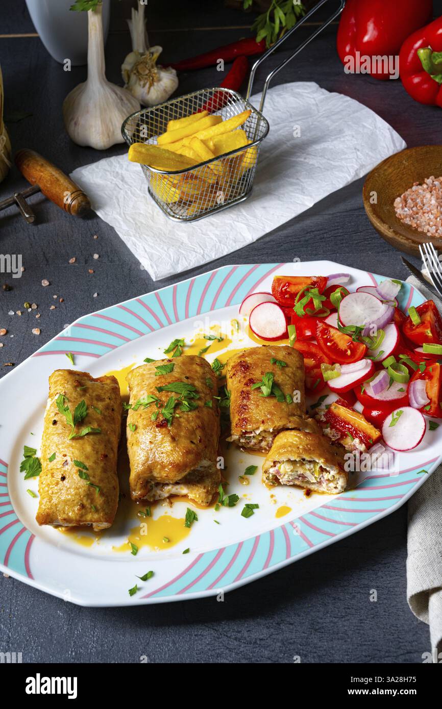 Roast pork vegetable roulade with salads Stock Photo - Alamy