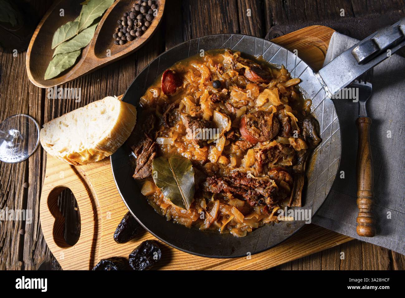 Polish bigos cooked according to an old recipe with wine and plums ...