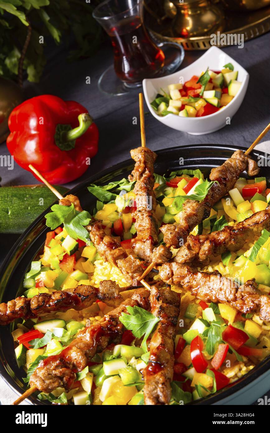Lamb kebabs with curry rice and various vegetables Stock Photo - Alamy