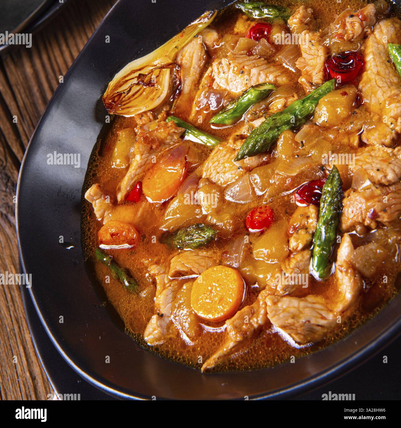 Colourful turkey fricassee with asparagus and peppers Stock Photo - Alamy